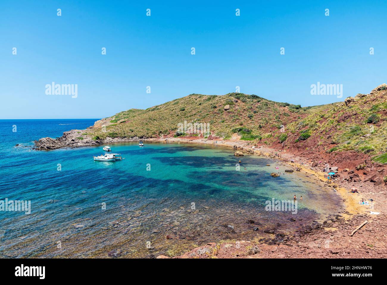 Overview of the Cavalleria beach with people around in Menorca, Balearic island, Spain Stock ...