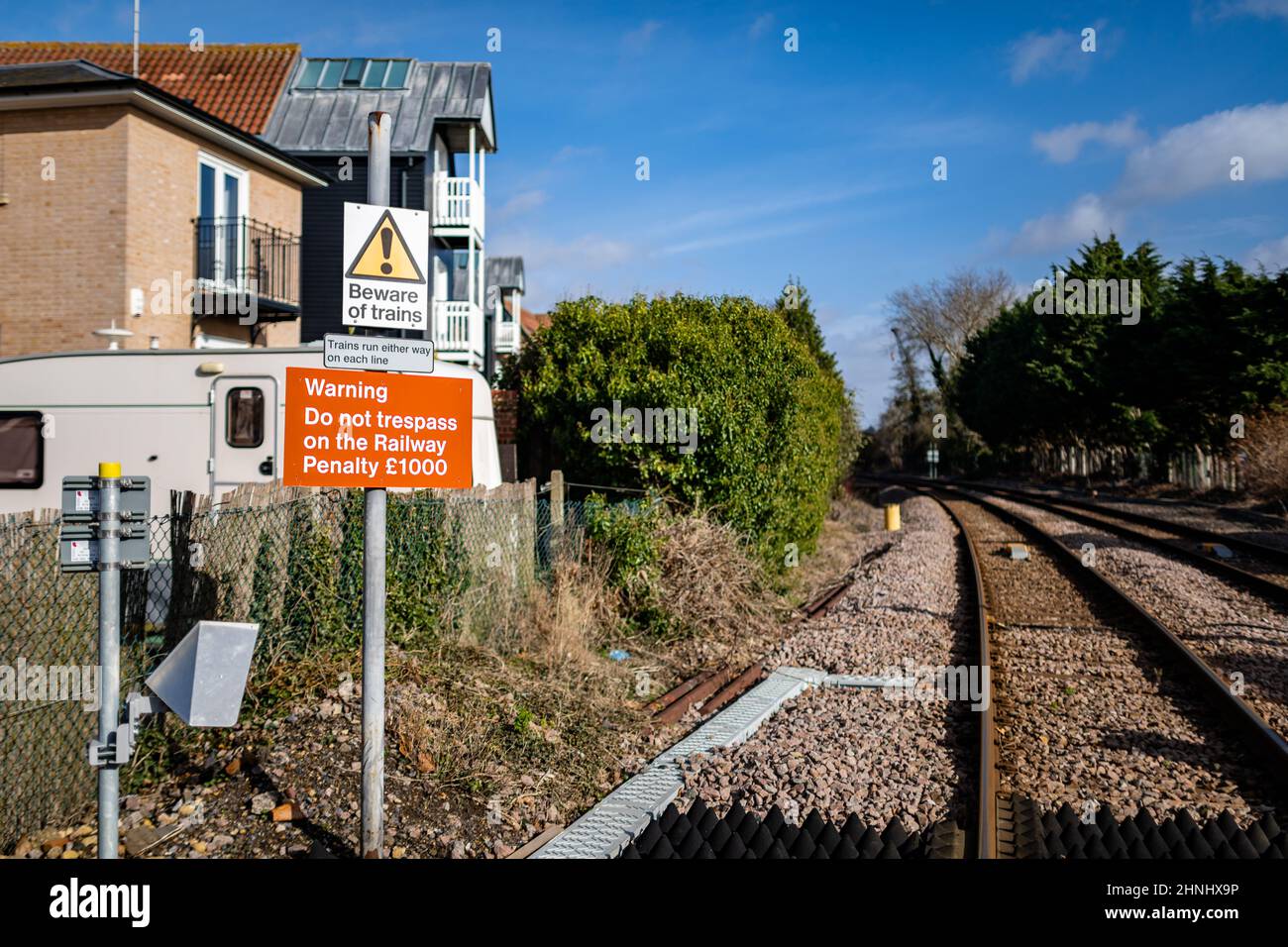 Warning signs on a level crossing informing the public to beware of ...