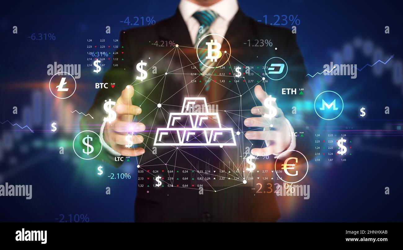 Businessman holding currency symbols Stock Photo - Alamy