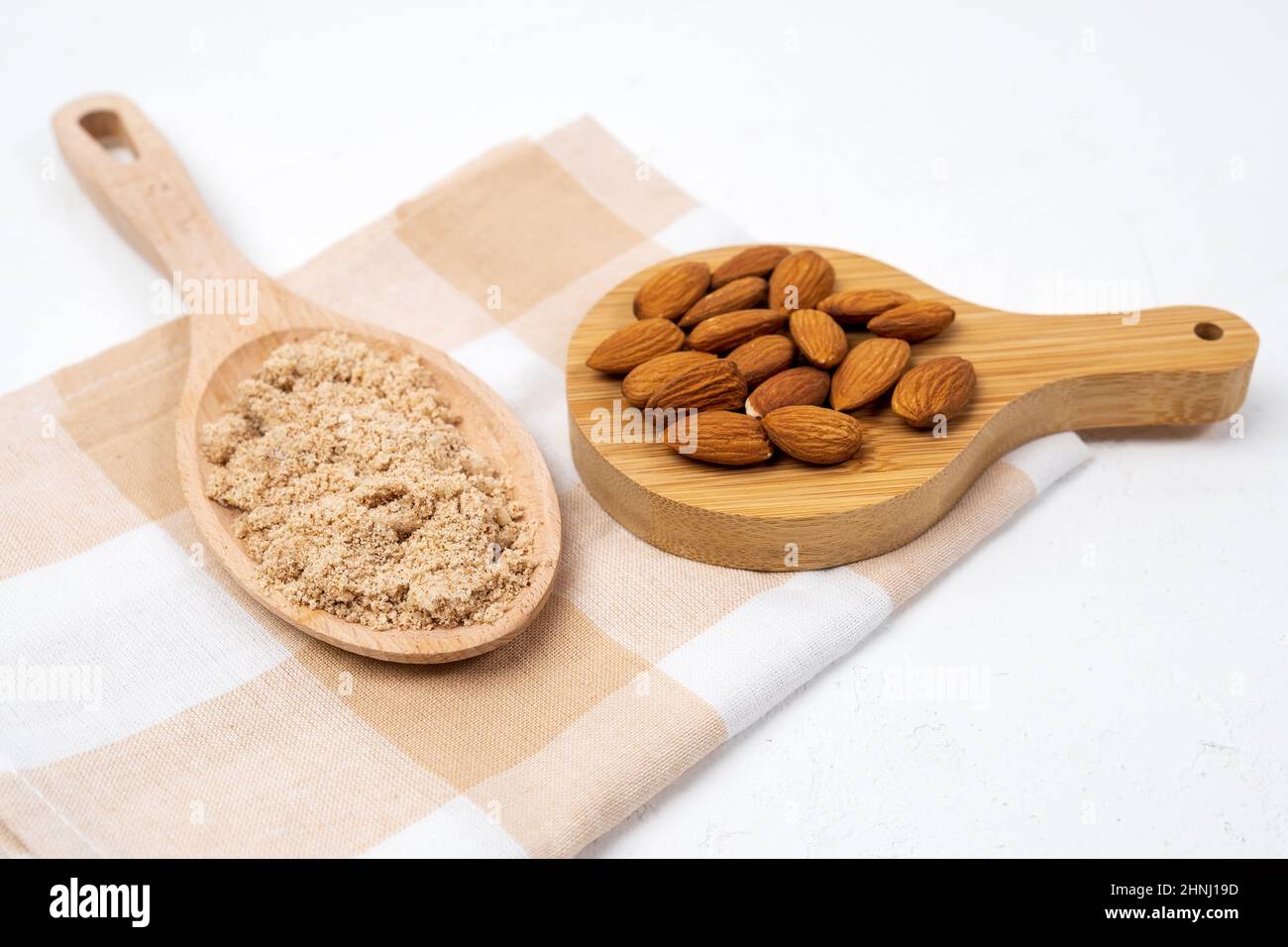 Alternative almond flour. Grated crushed almonds, white background ...