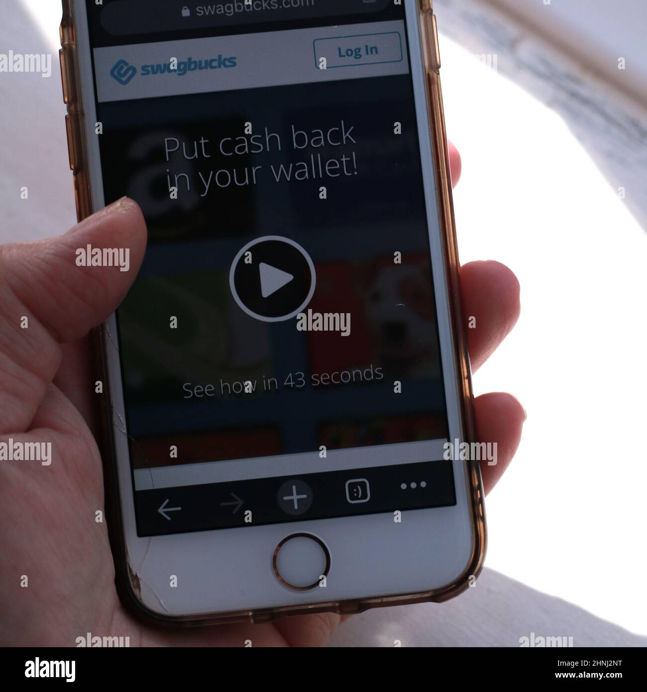 Tech lifestyle - close view of a female hand holding mobile phone ...
