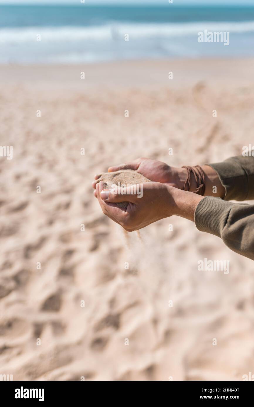 Hand with sand hi-res stock photography and images - Alamy
