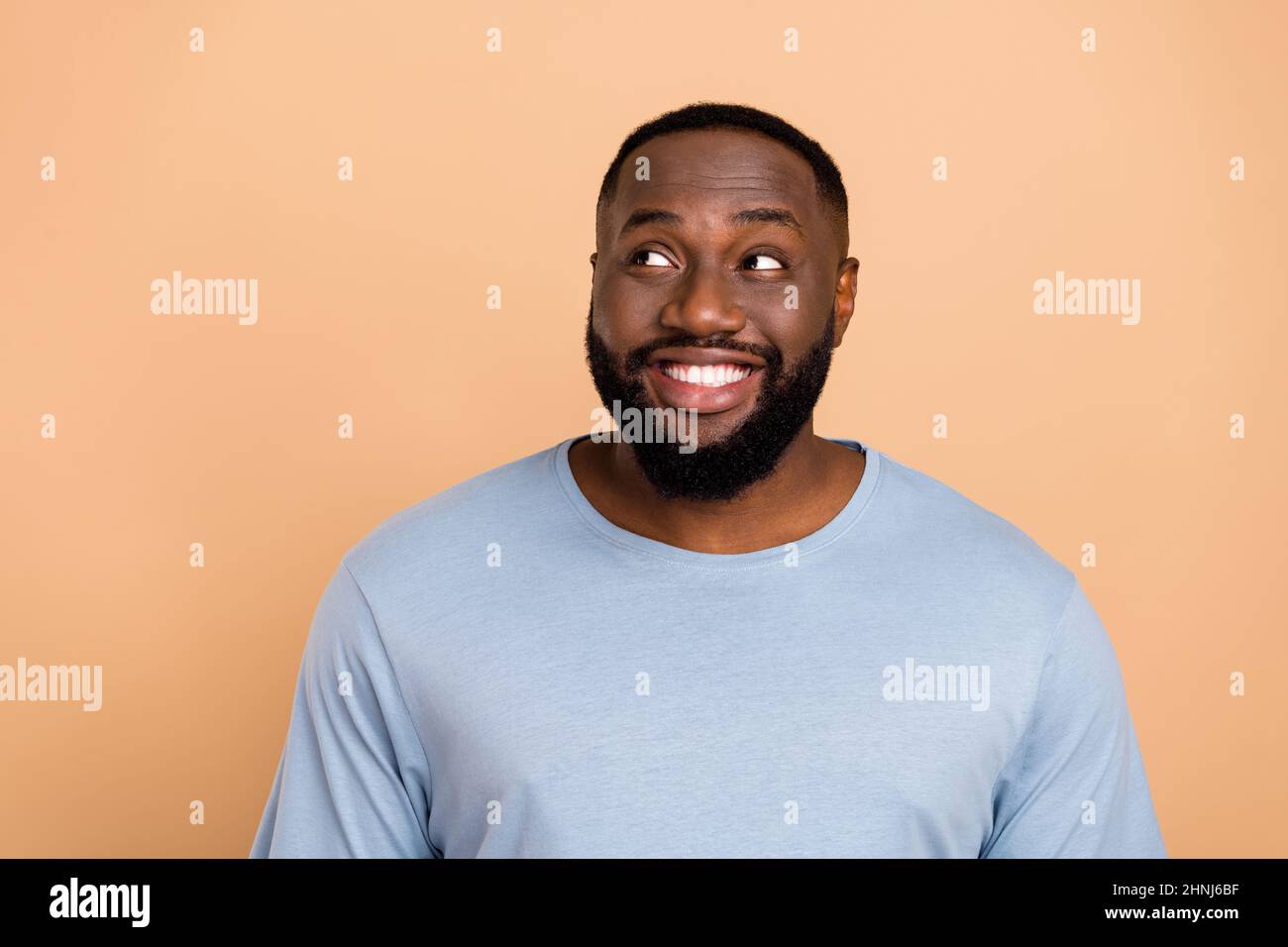 Portrait of attractive cheerful curious guy thinking copy blank space ...
