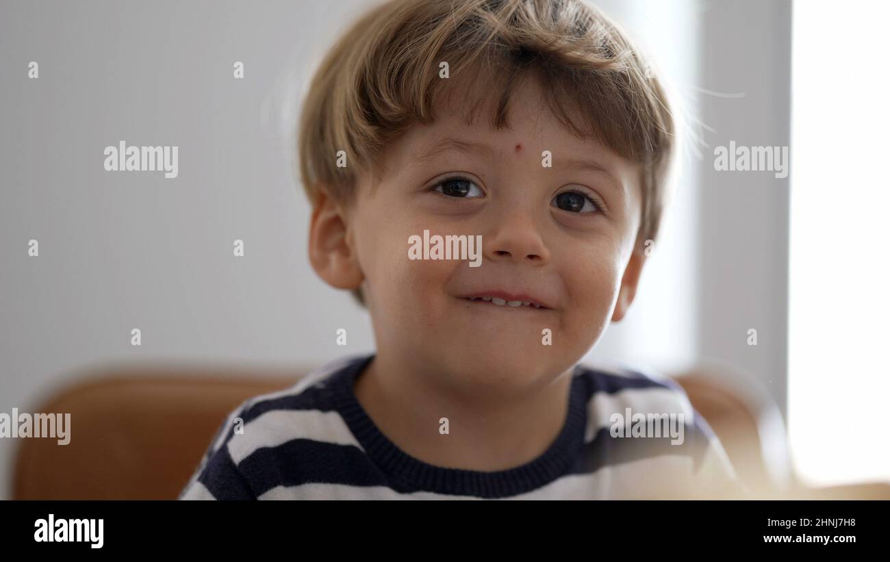 One child shakes head and hair being goofy and fun Stock Photo - Alamy