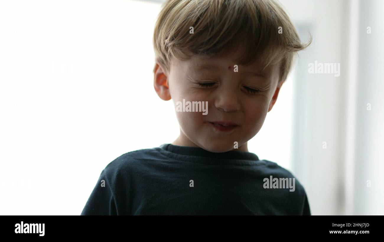 One Cute little boy closing eyes child eyes closed Stock Photo - Alamy