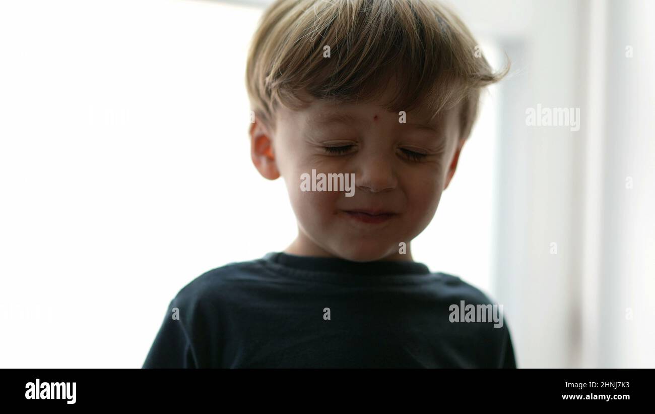 One Cute little boy closing eyes child eyes closed Stock Photo - Alamy