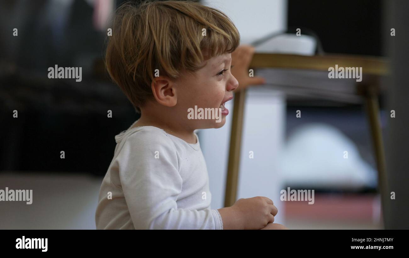 One crying little toddler child cries desperately doing a tantrum Stock ...