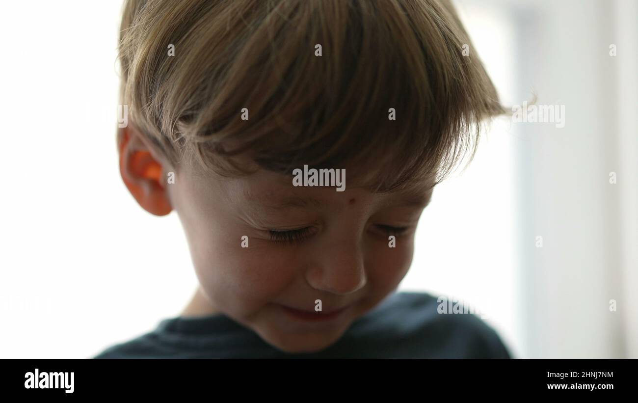 One cute goofy child eyes closed adorable kid opening eyes Stock Photo ...