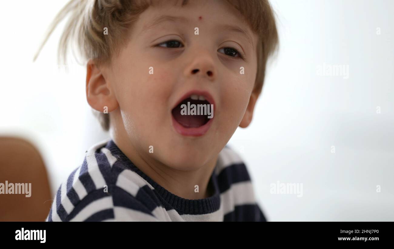 One little boy shakes head and hair Stock Photo - Alamy