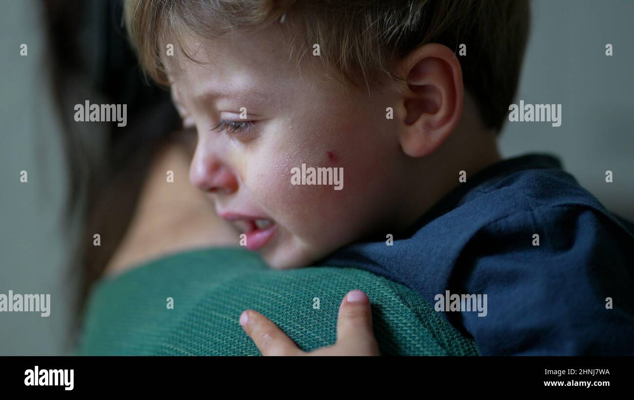 One tearful little boy crying mother consoling child Stock Photo - Alamy One tearful little boy crying mother consoling child Stock Photo - Alamy