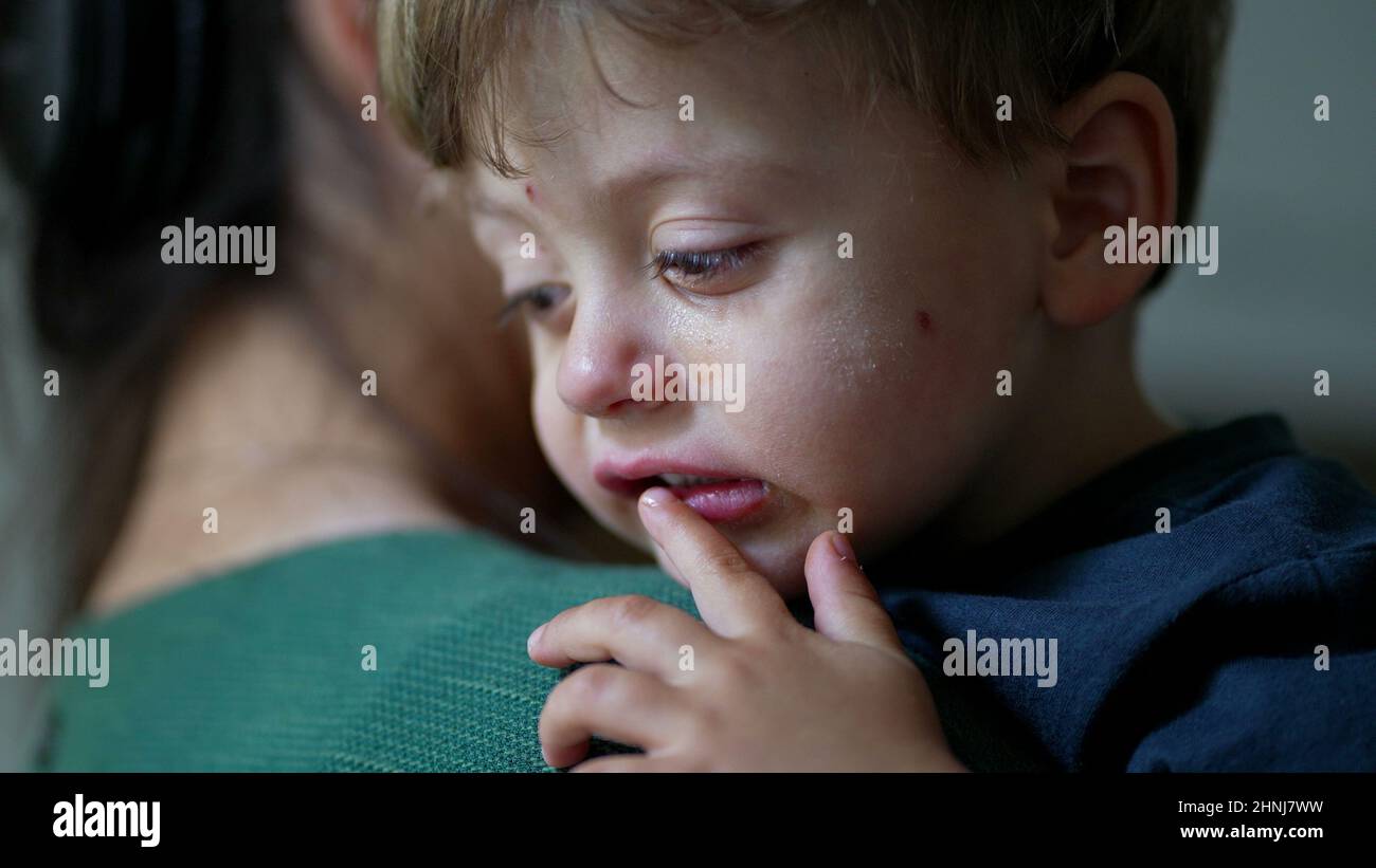 One tearful little boy crying mother consoling child Stock Photo - Alamy