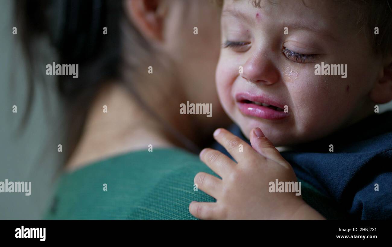 One tearful little boy crying mother consoling child Stock Photo - Alamy One tearful little boy crying mother consoling child Stock Photo - Alamy