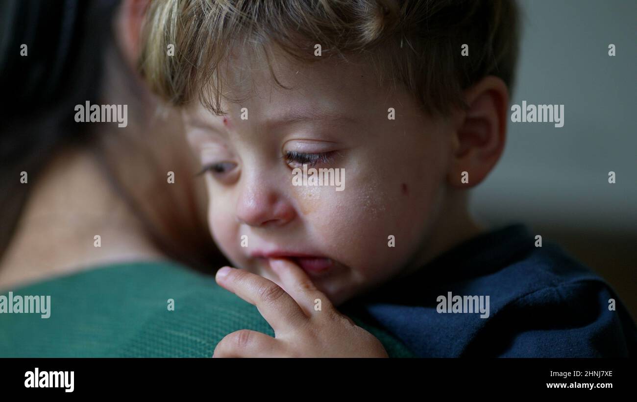 One tearful little boy crying mother consoling child Stock Photo - Alamy