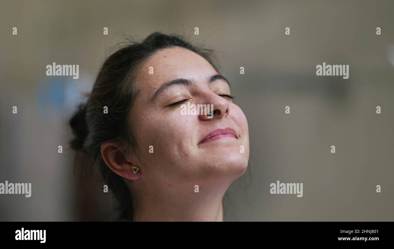 Person looking at sky closing eyes satisfied woman eyes closed in ...