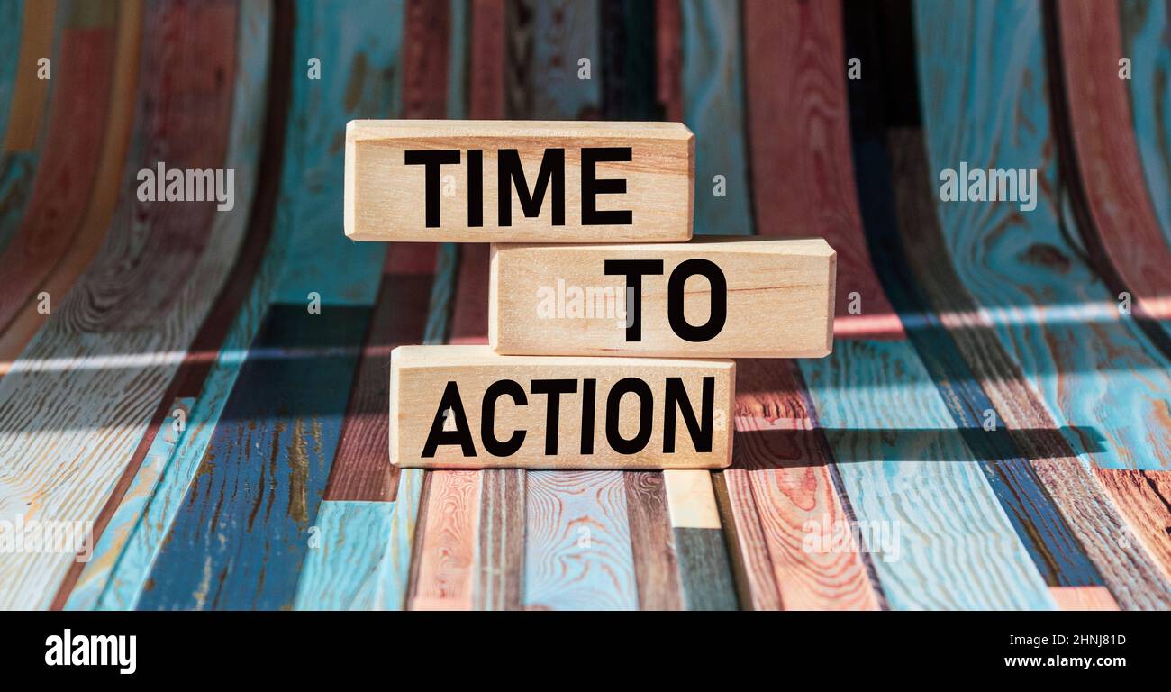 TIME TO ACTION text on wooden blocks and striped background Stock Photo ...