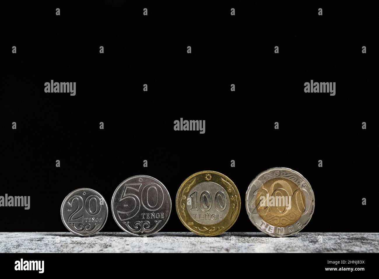Kazakh coins in denominations of 20, 50, 100 and 200 tenge stand on a ...