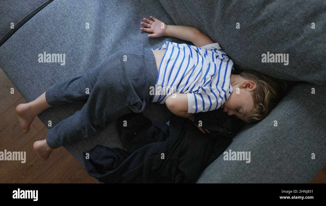 Small boy napping on sofa child sleeping on couch Stock Photo - Alamy