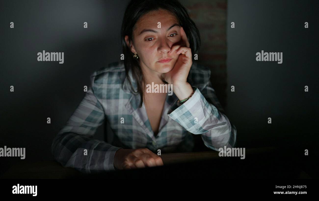 Tired woman in front of computer screen at night alone Stock Photo - Alamy