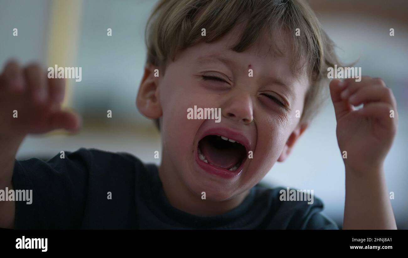 Upset child crying one small boy cries Stock Photo - Alamy