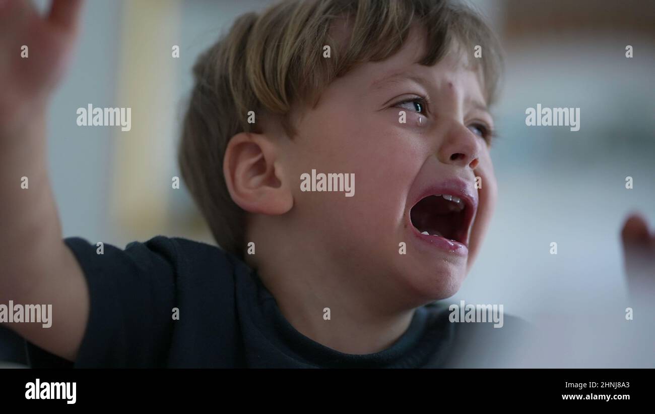 Upset child crying one small boy cries Stock Photo - Alamy