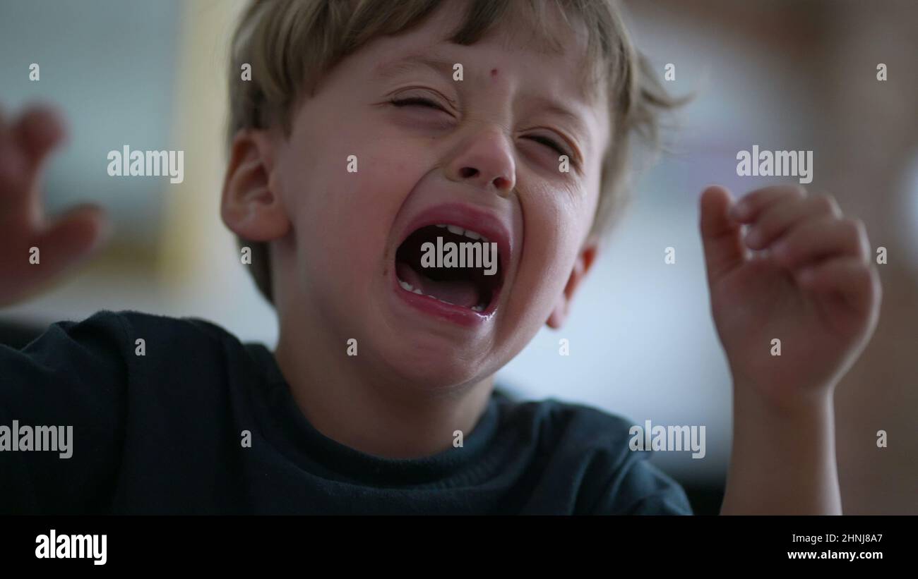 Upset child crying one small boy cries Stock Photo - Alamy