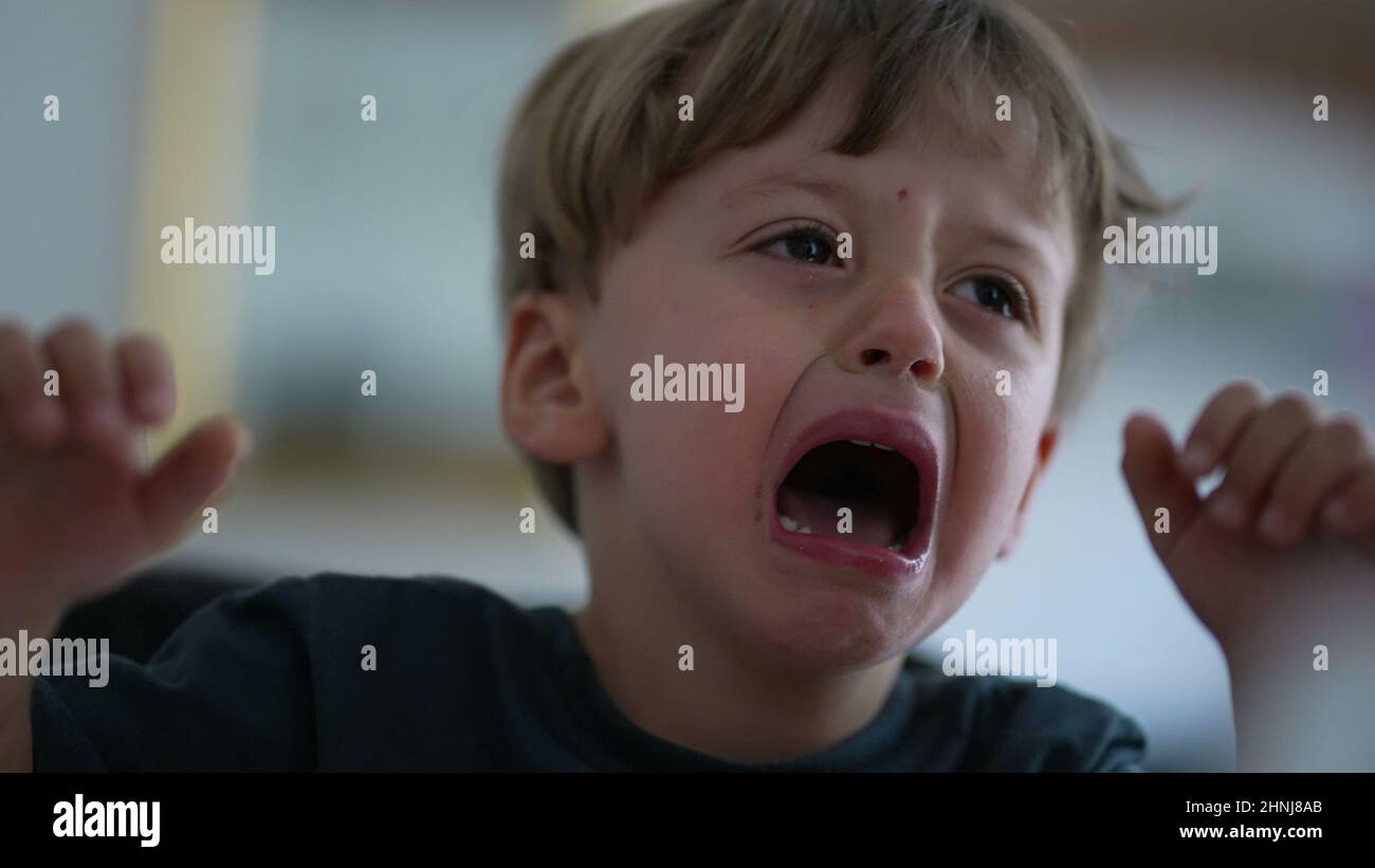 Upset child crying one small boy cries Stock Photo - Alamy