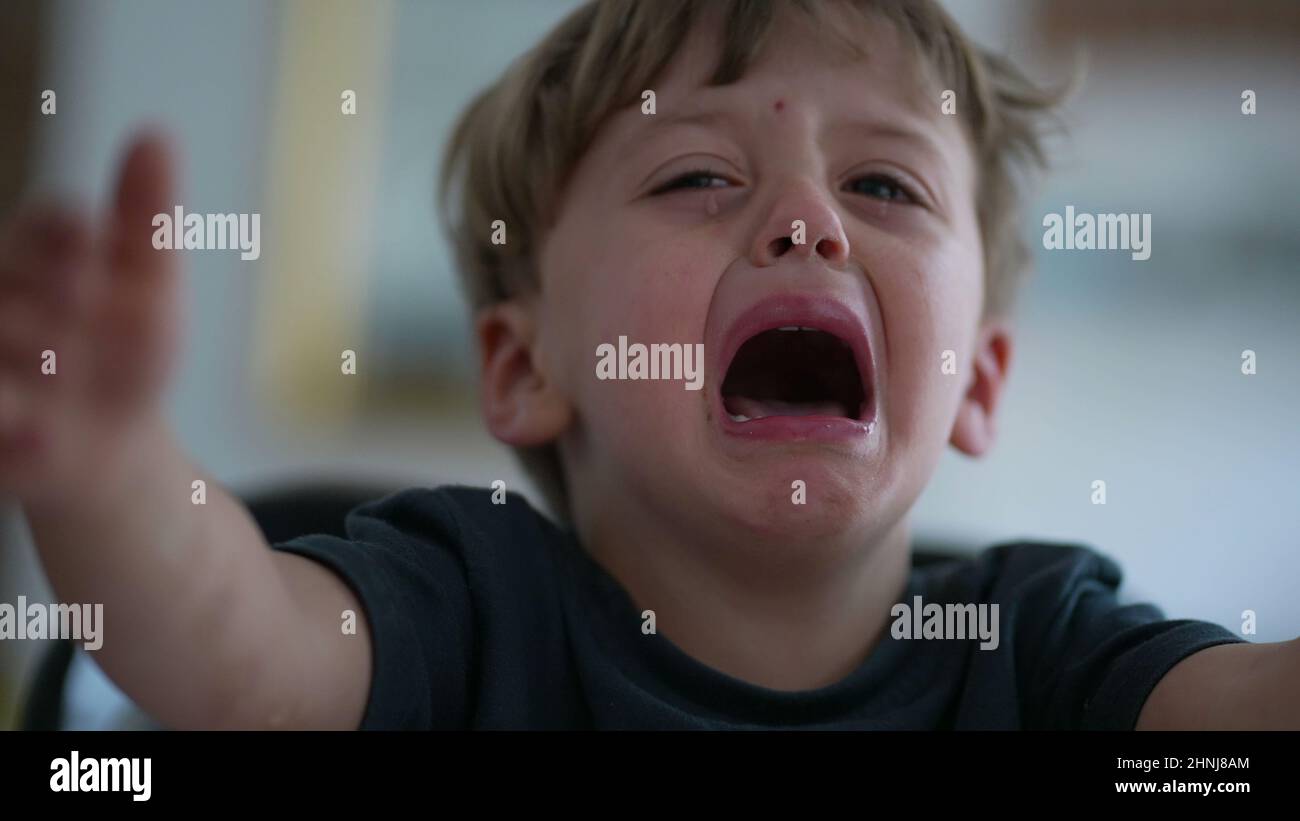 Upset child crying one small boy cries Stock Photo - Alamy