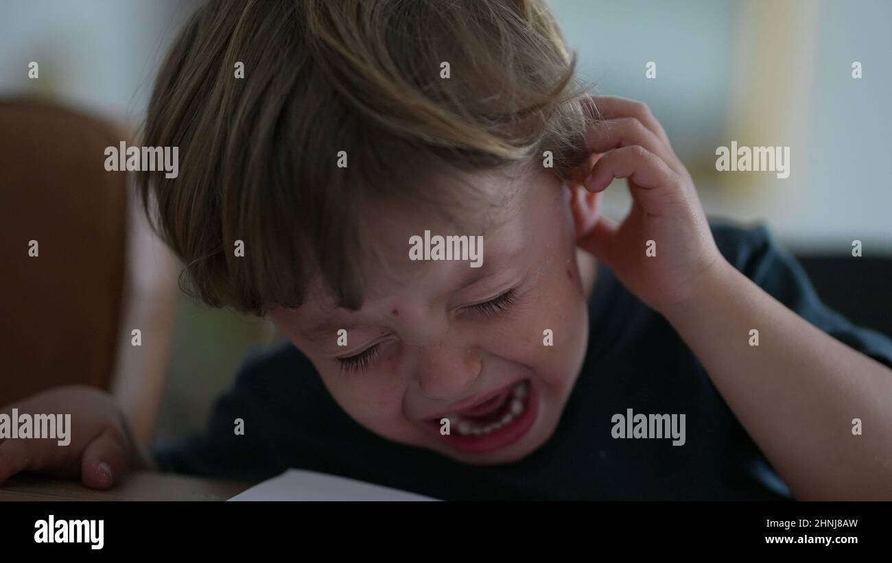 Upset child crying one small boy cries Stock Photo - Alamy