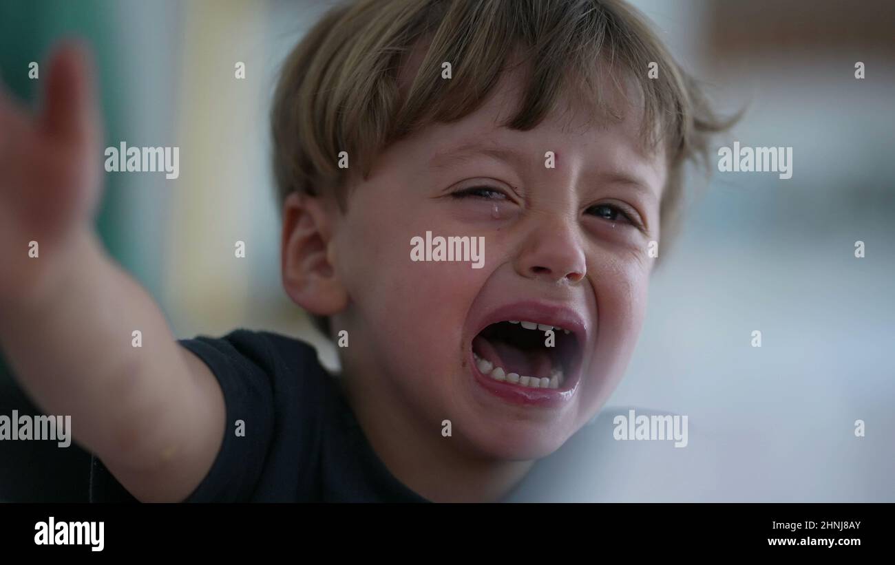 Upset child crying one small boy cries Stock Photo - Alamy