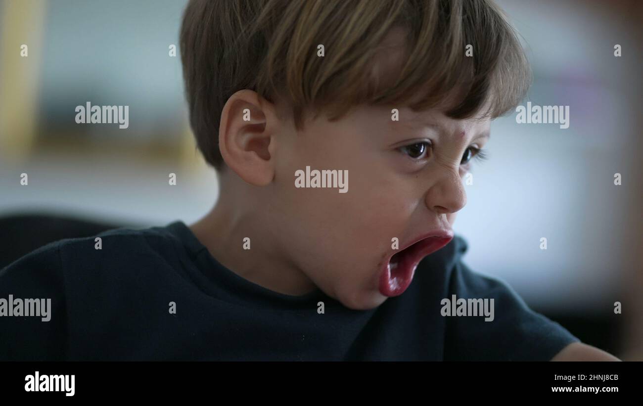 Upset little boy yelling angry child screaming Stock Photo - Alamy