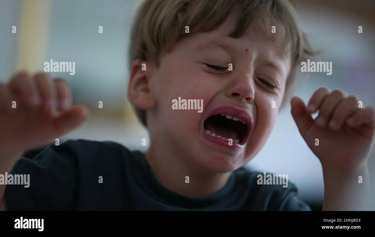 Upset child crying one small boy cries Stock Photo - Alamy