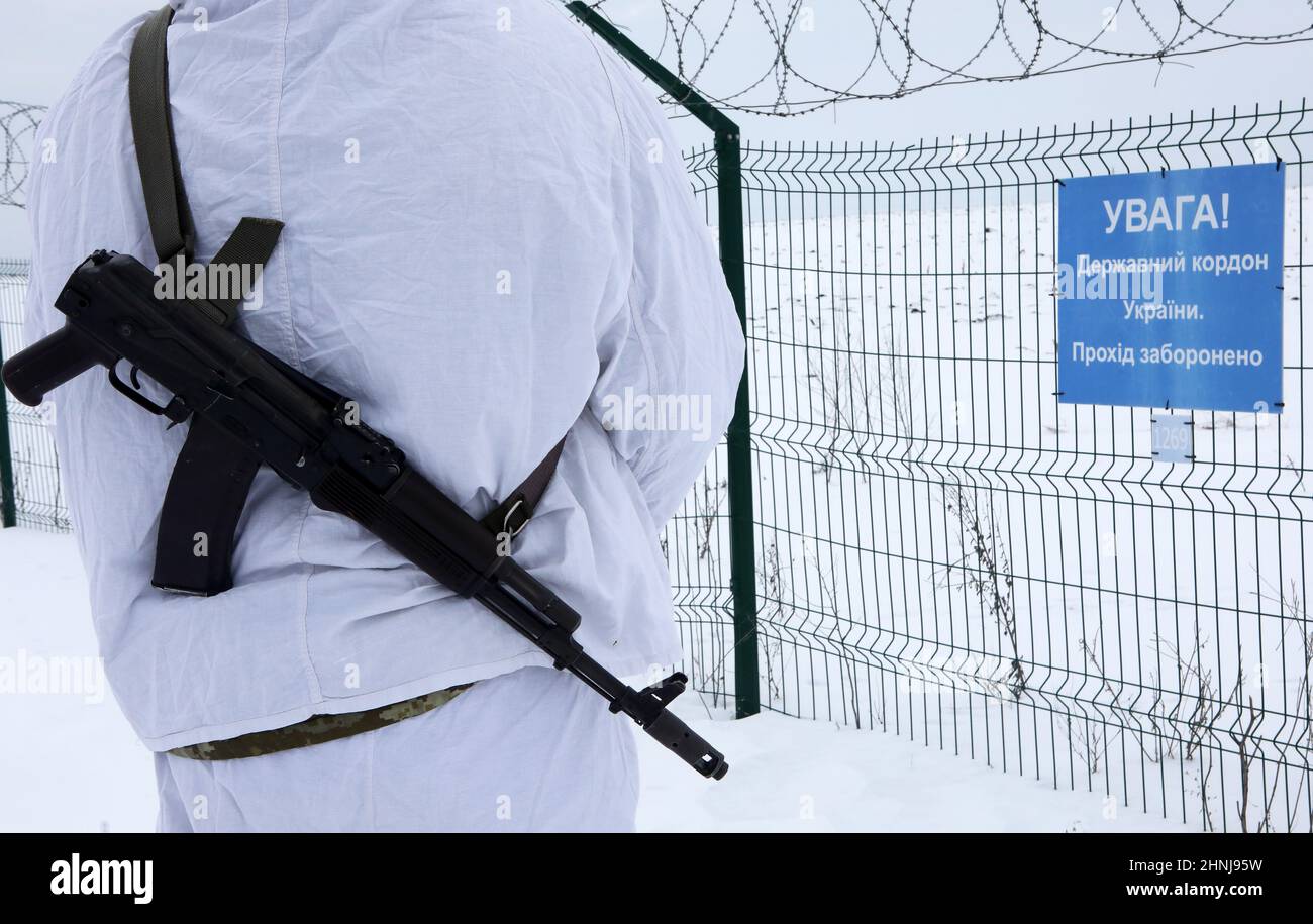 KHARKIV REGION, UKRAINE - FEBRUARY 16, 2022 - An armed border guard in ...