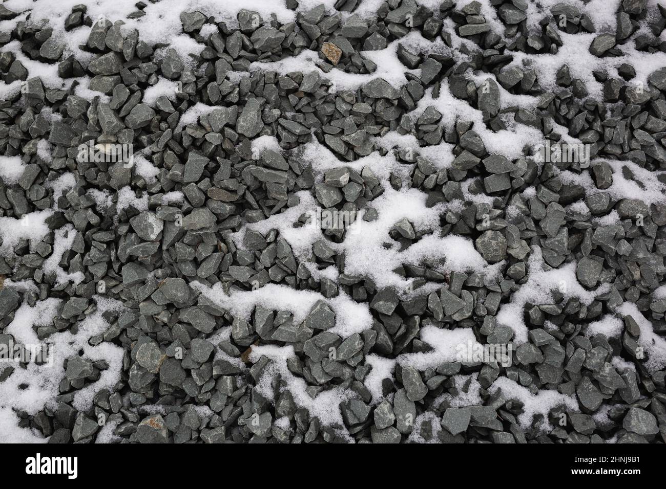 dark gray gravel in the snow. great background for your design Stock ...