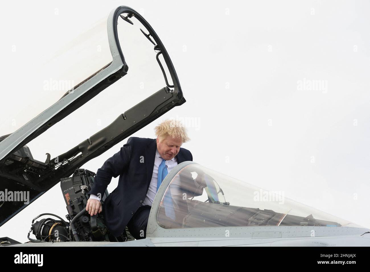 Prime Minister Boris Johnson climbs into military plane during his ...