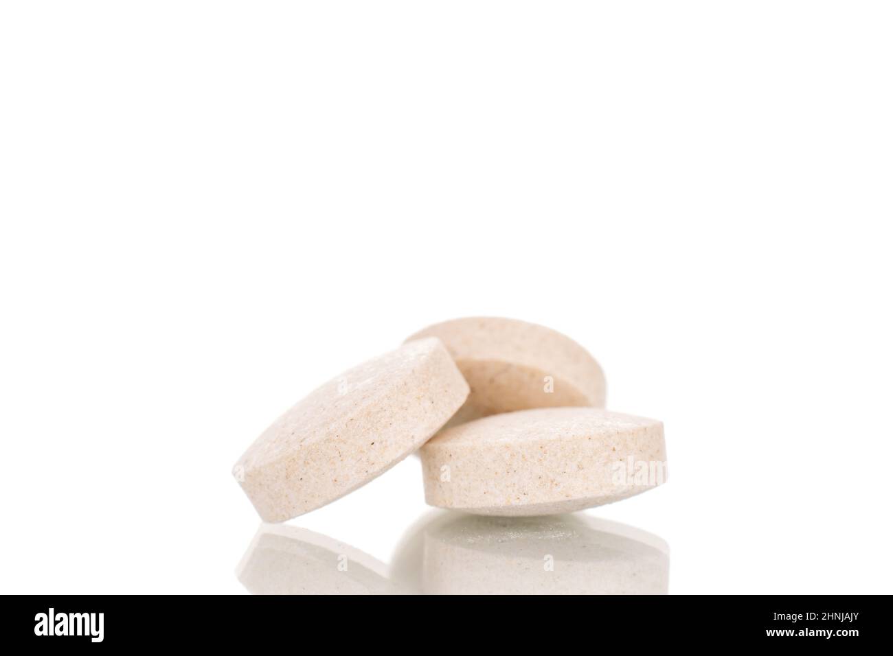 Three medical tablets, macro, isolated on a white background Stock ...