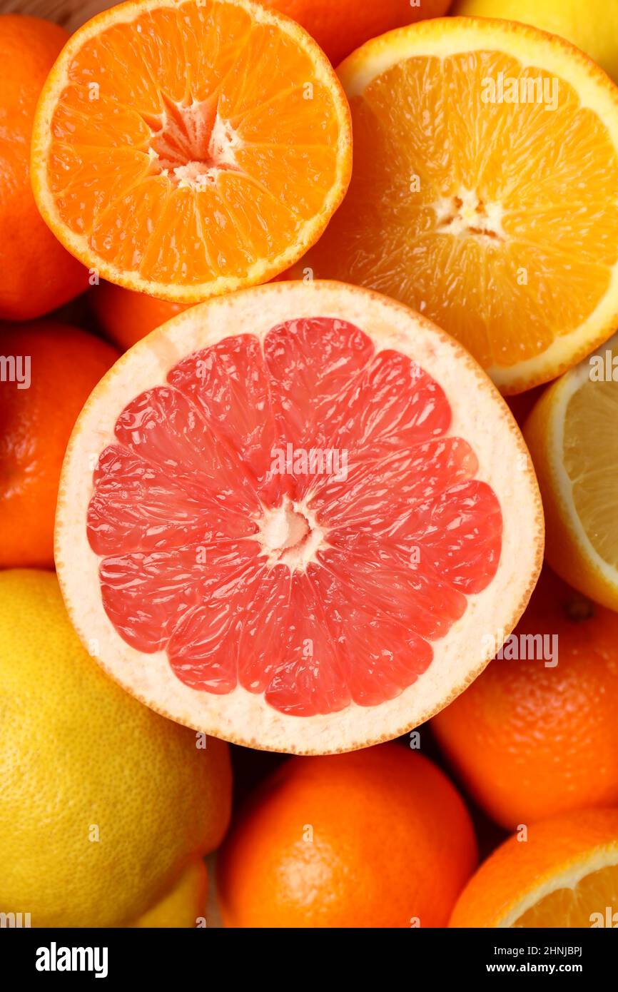 Various whole and half citrus fruits, close up Stock Photo - Alamy