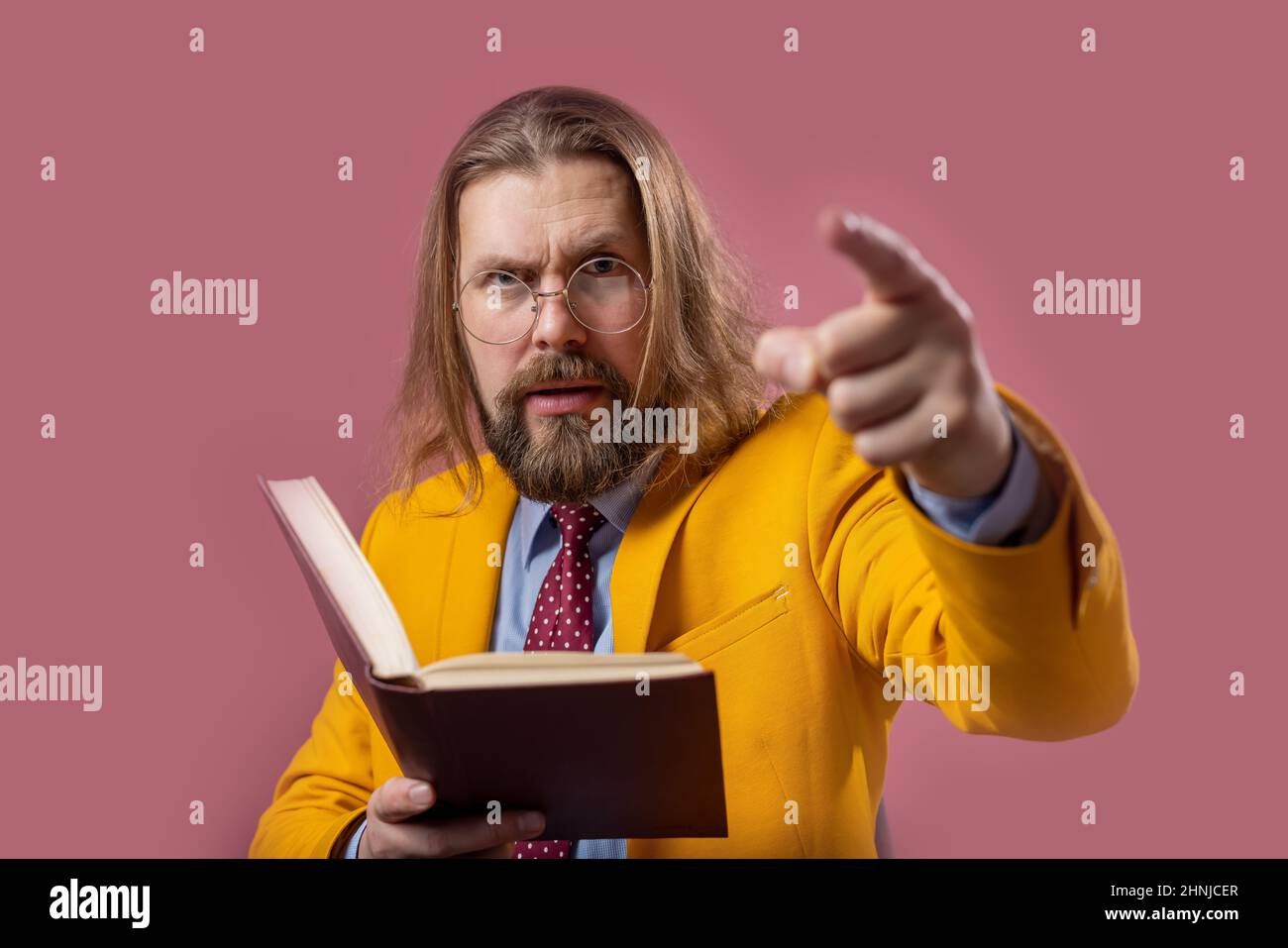 Bearded man pointing book hi-res stock photography and images - Alamy
