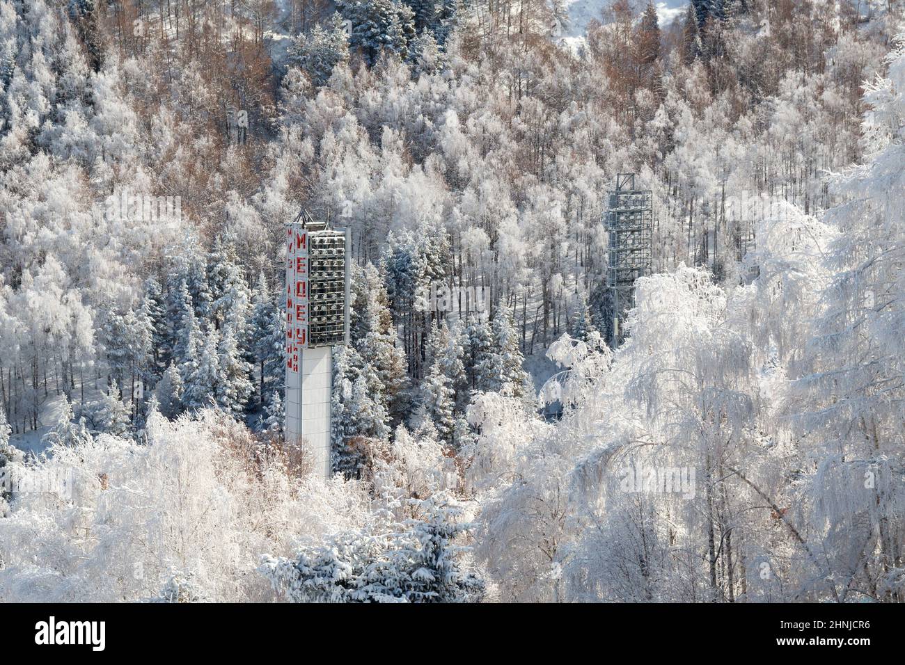 Almaty, Kazakhstan - March 16, 2021: A view from behind the snowy trees ...