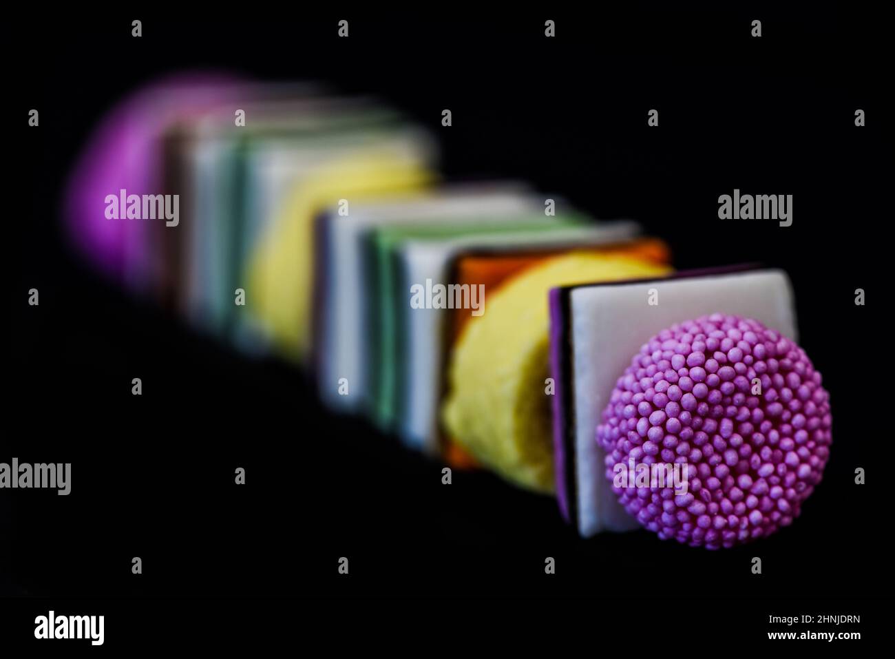 Yellow black white liquorice allsorts hi-res stock photography and ...