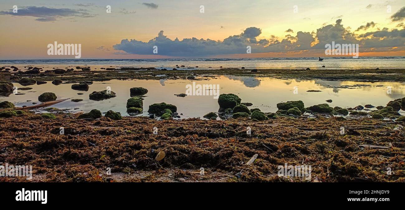 Crowdy beach, still lagoon, wavy sea Stock Photo - Alamy