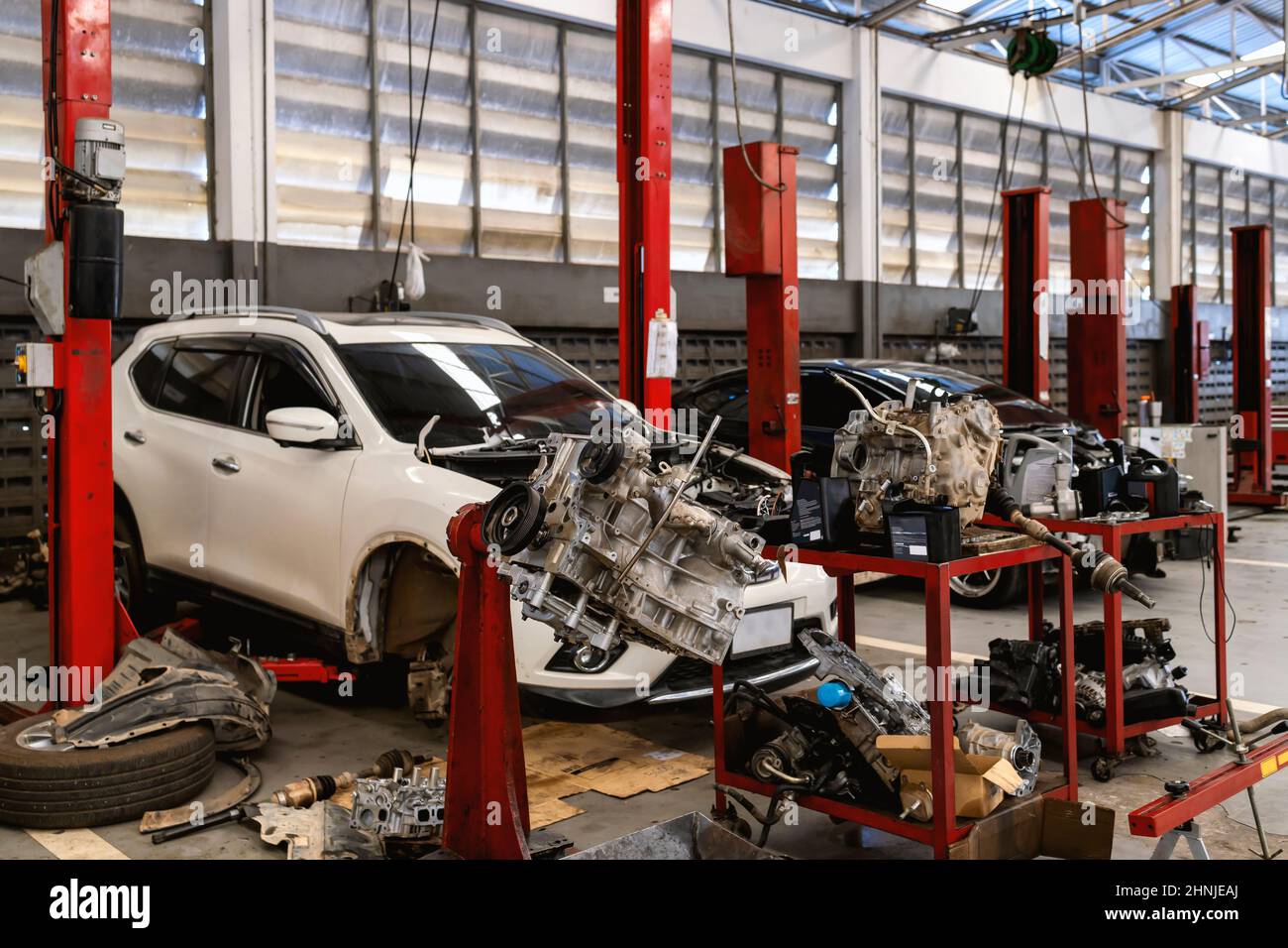 closeup detail of car engine in service center with soft-focus and over ...