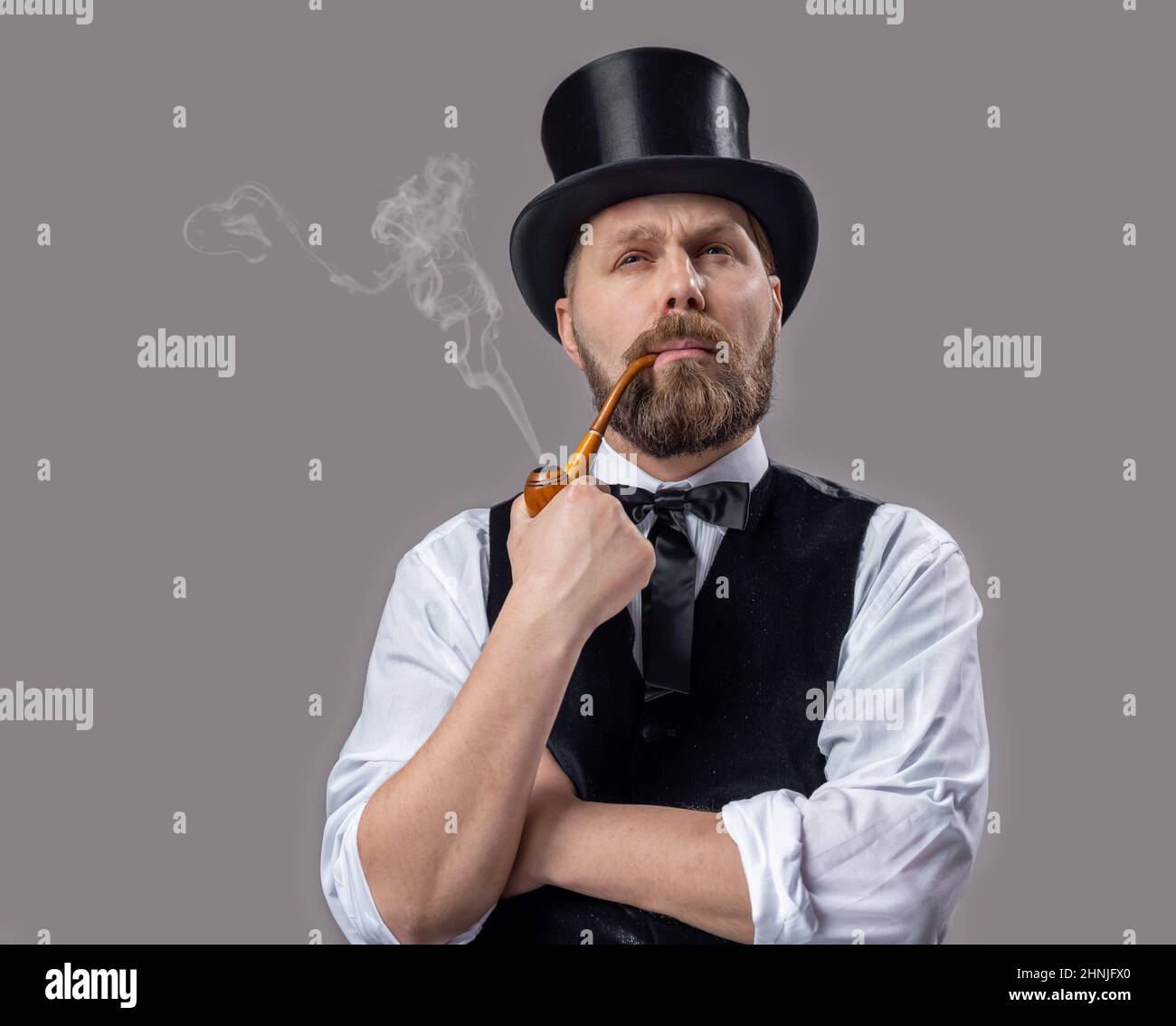 Retro styled gentleman smoking pipe Stock Photo - Alamy