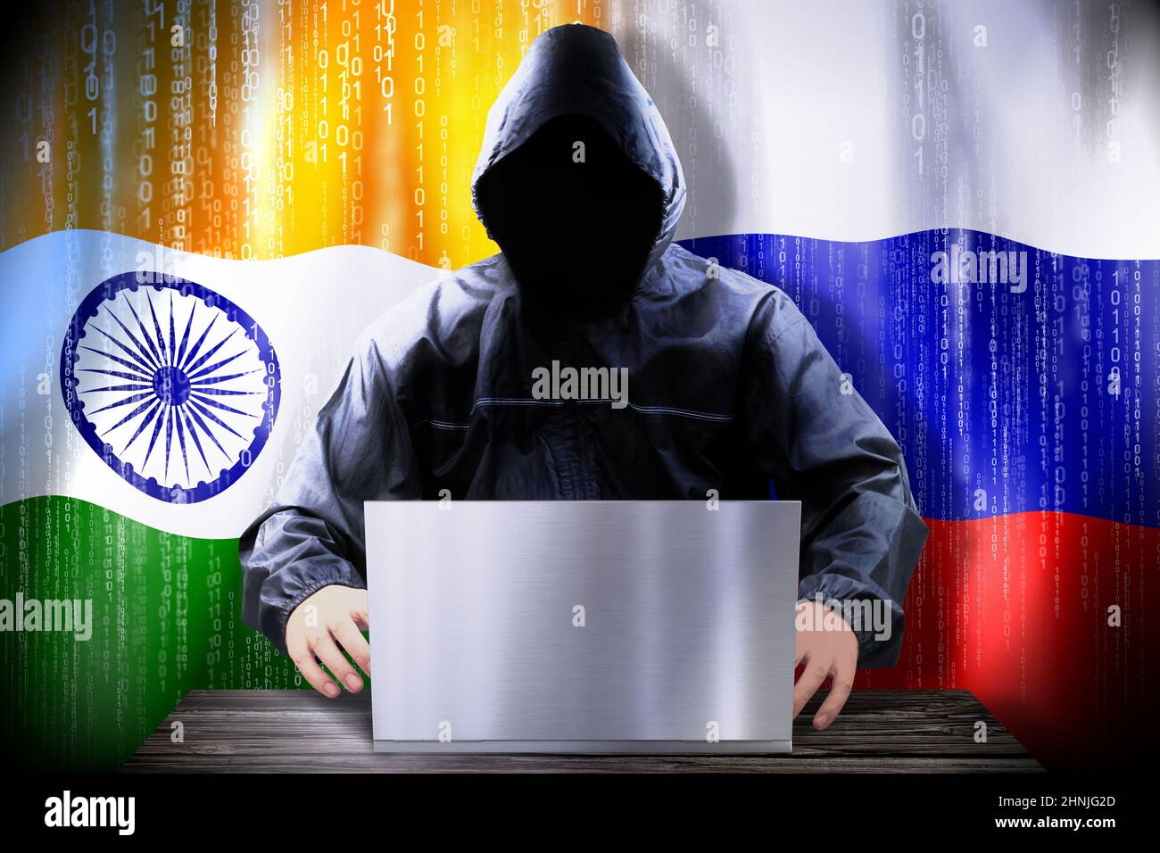 Anonymous hacker working on a laptop, flags of India and Russia Stock ...