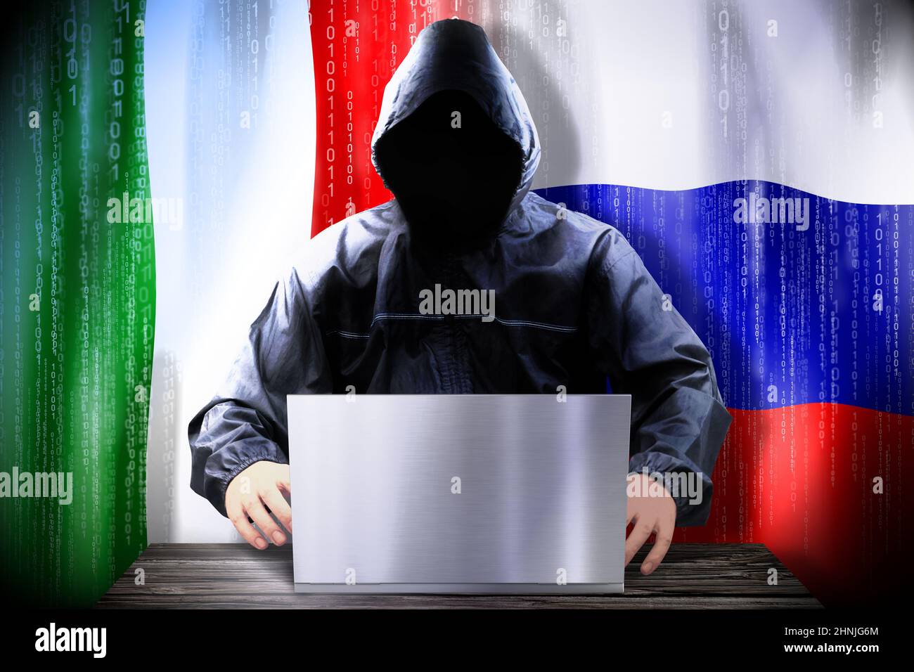 Anonymous hacker working on a laptop, flags of Italy and Russia Stock ...