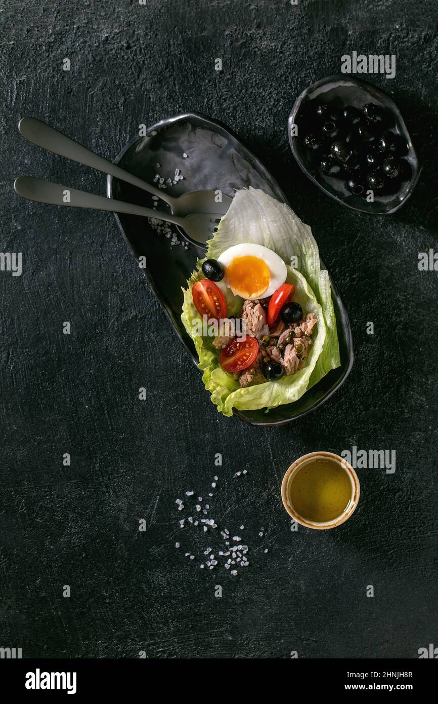 Vegetarian traditional nicoise salad with canned tuna fish, olives and ...