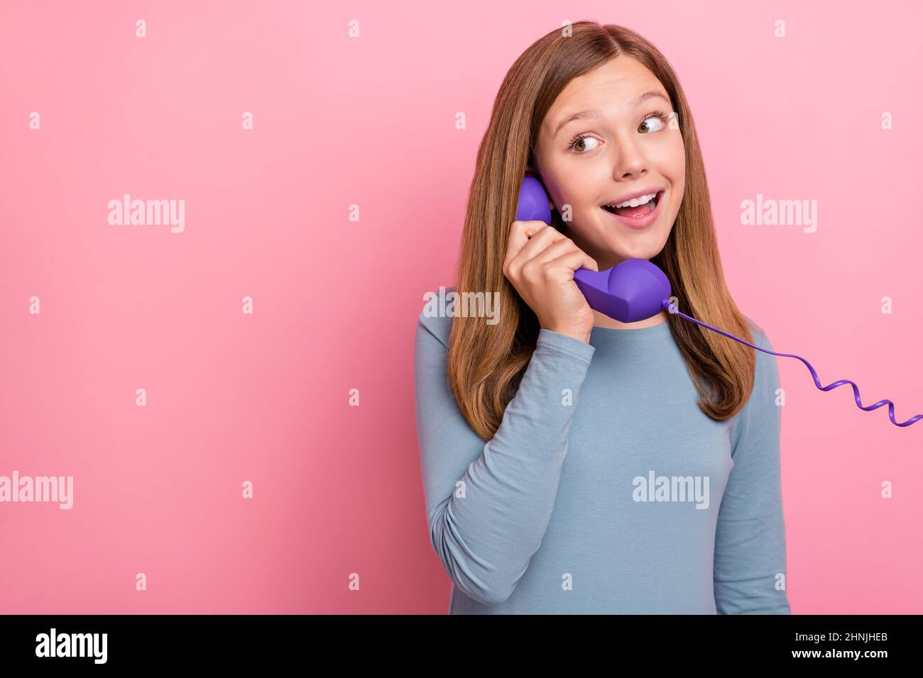Portrait of attractive cheerful funny girl talking on phone copy blank ...
