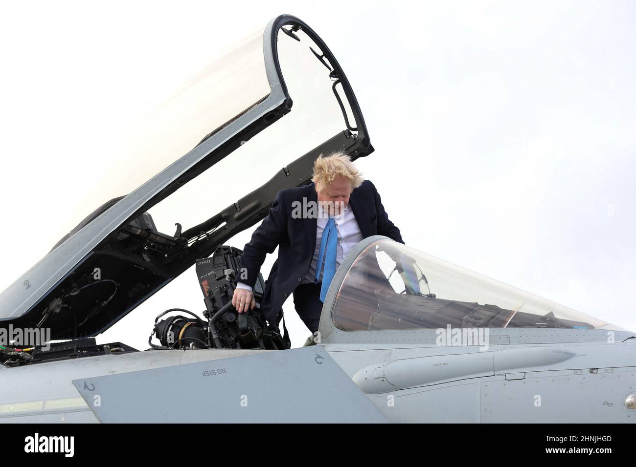 Prime Minister Boris Johnson climbs in a military plane during his ...