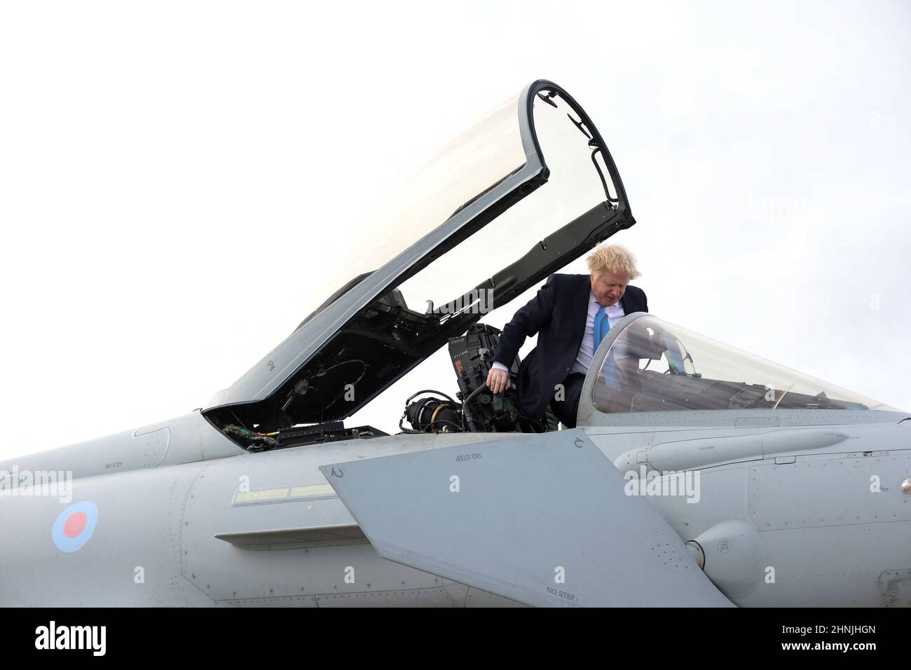 Prime Minister Boris Johnson climbs in a military plane during his ...