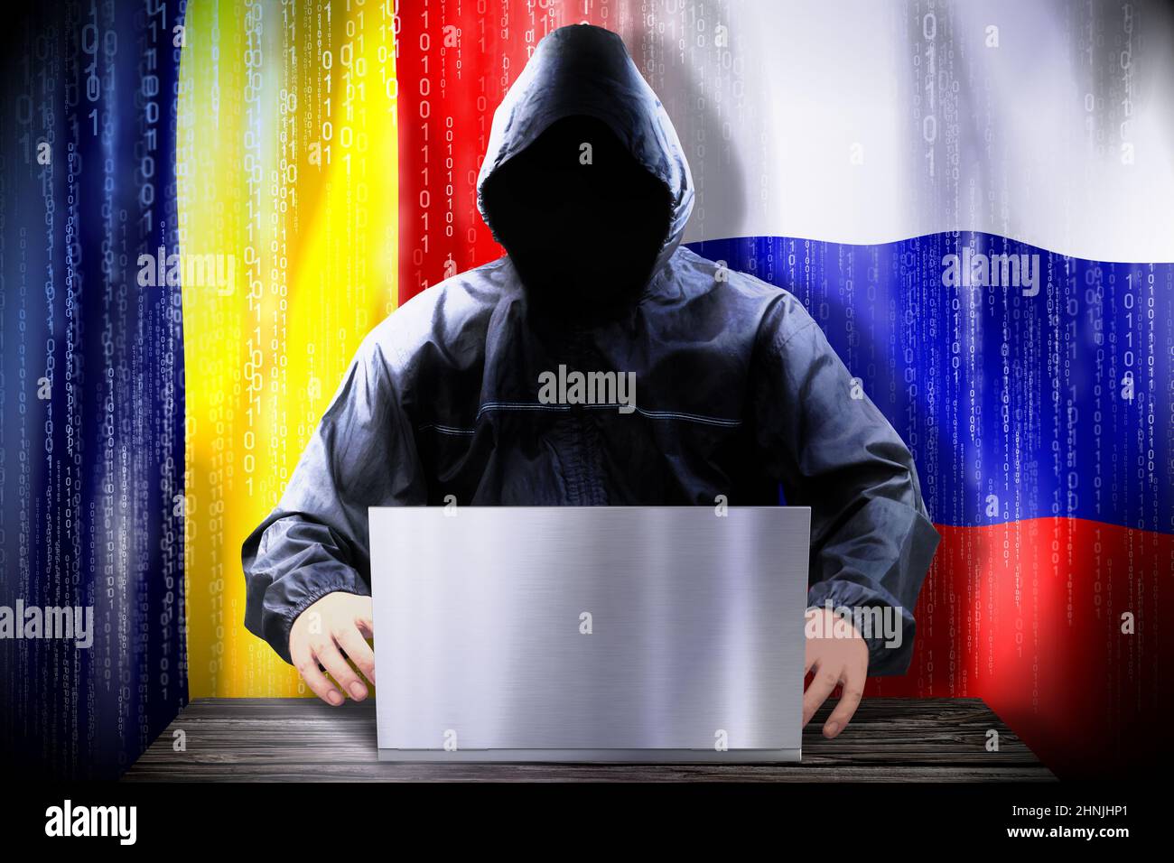 Anonymous hacker working on a laptop, flags of Romania and Russia Stock ...