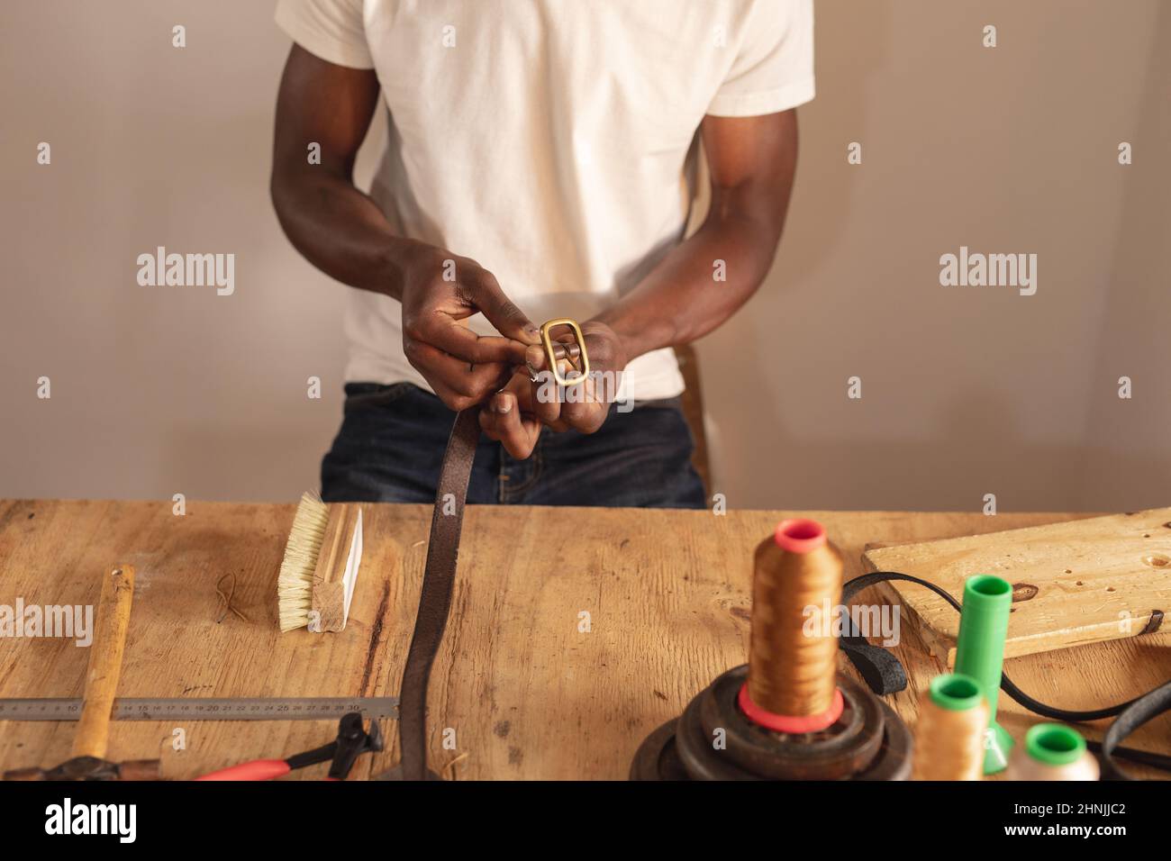 Fixing his belt hi-res stock photography and images - Alamy